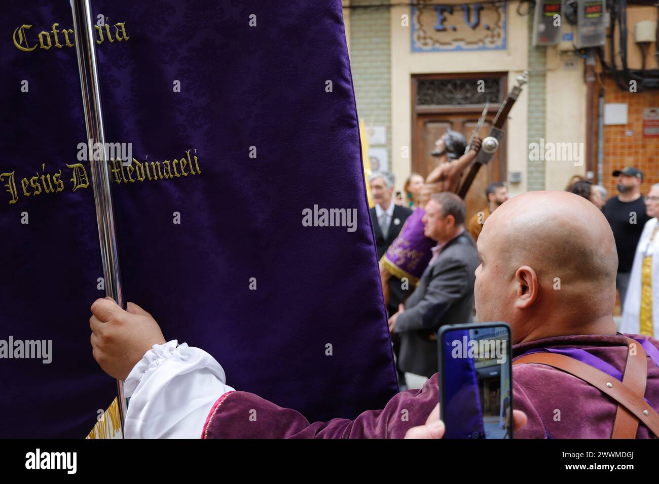 Penitents during a Holy week parade at Cabanyal quarter in Valencia ...