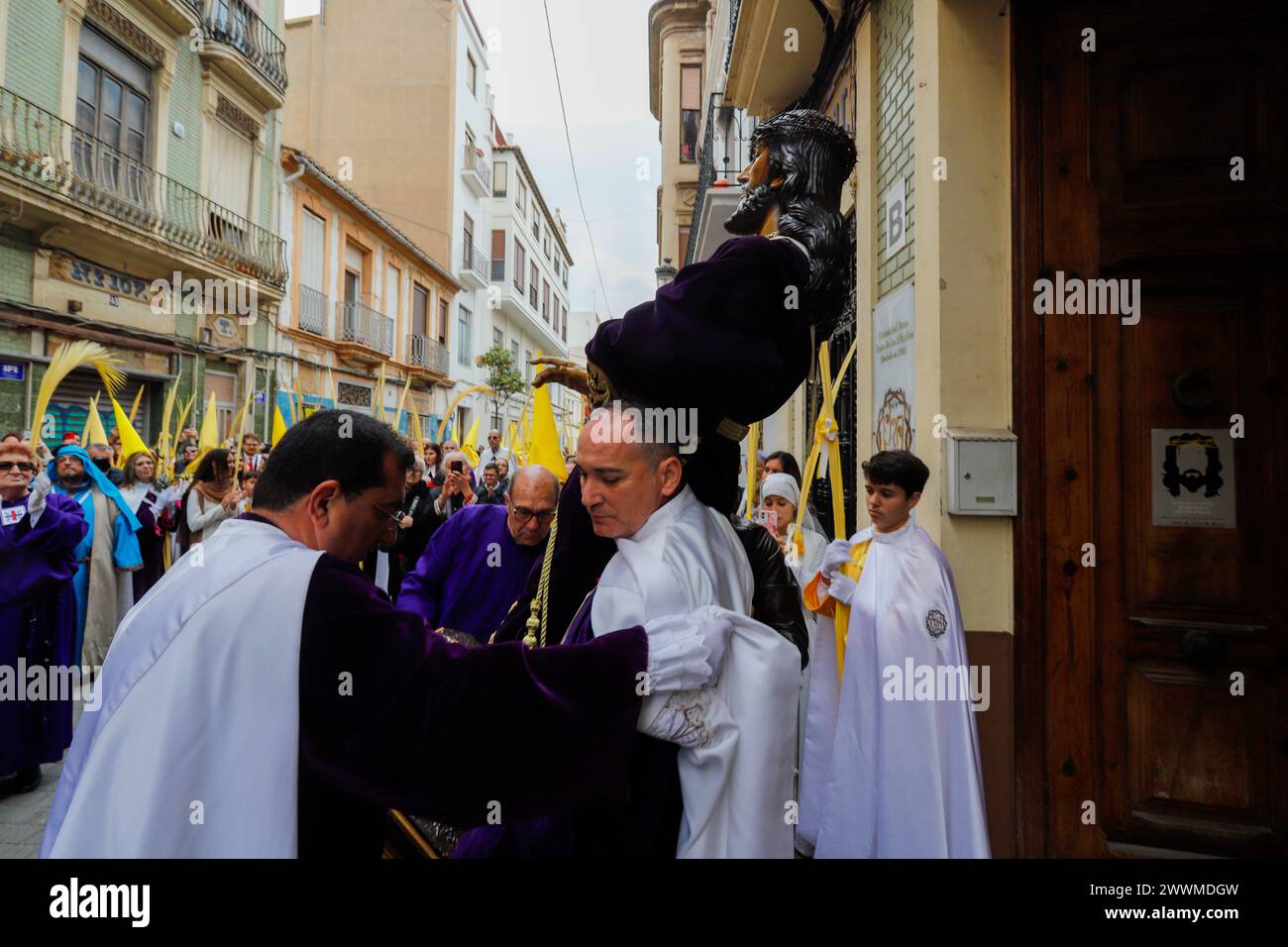 Penitents during a Holy week parade at Cabanyal quarter in Valencia ...