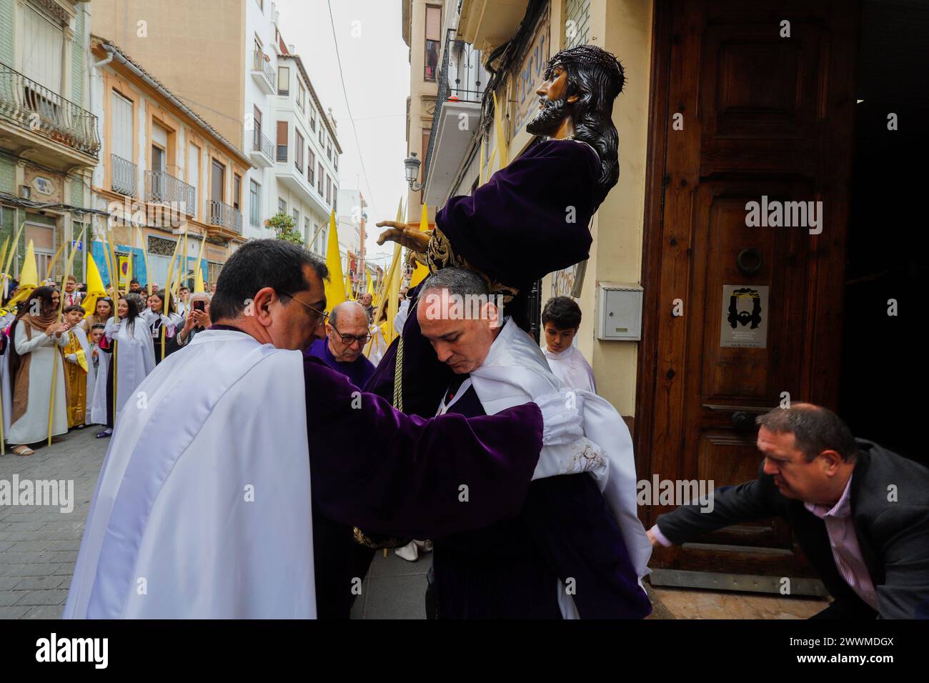 Penitents during a Holy week parade at Cabanyal quarter in Valencia ...