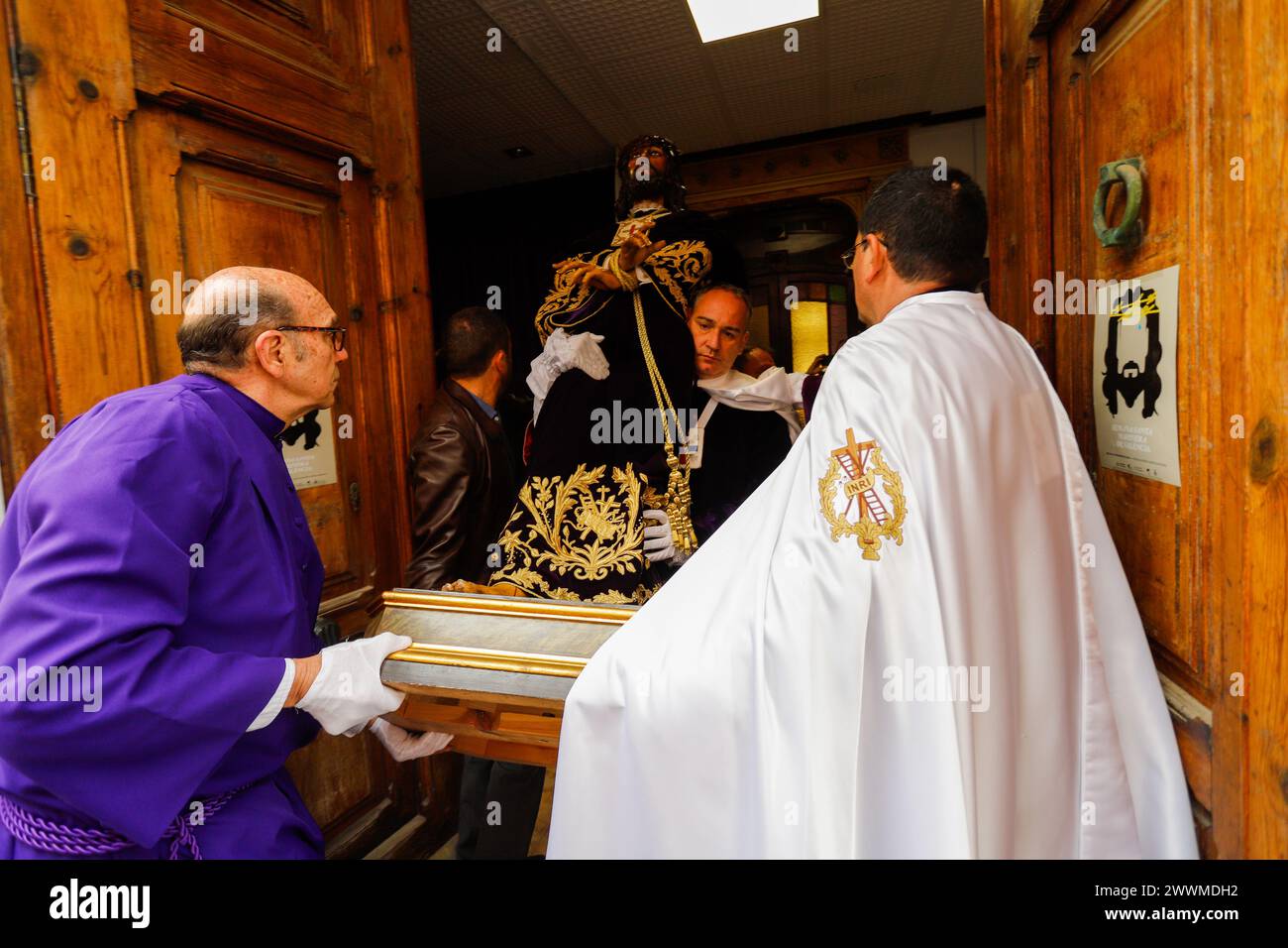 Penitents during a Holy week parade at Cabanyal quarter in Valencia ...