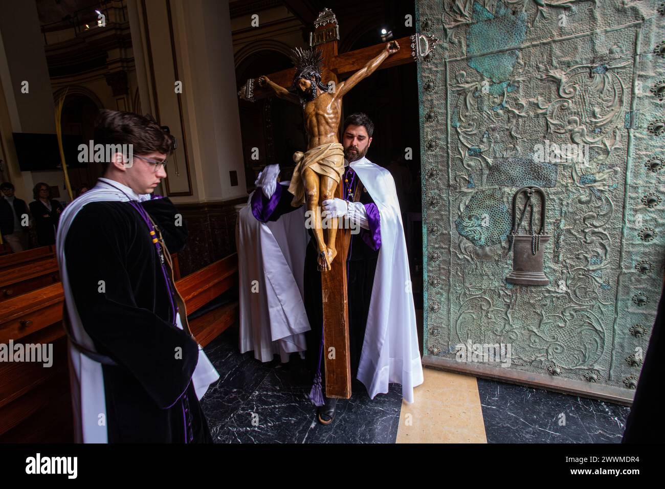 Penitents during a Holy week parade at Cabanyal quarter in Valencia ...