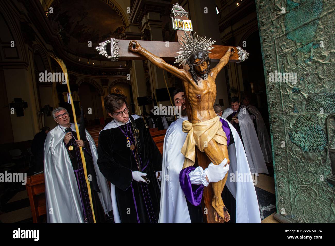 Penitents during a Holy week parade at Cabanyal quarter in Valencia ...