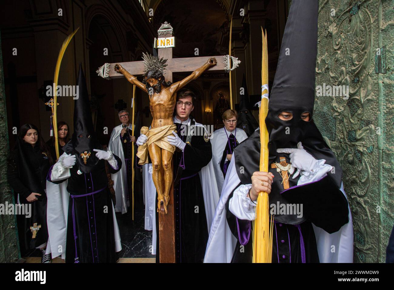 Penitents during a Holy week parade at Cabanyal quarter in Valencia ...