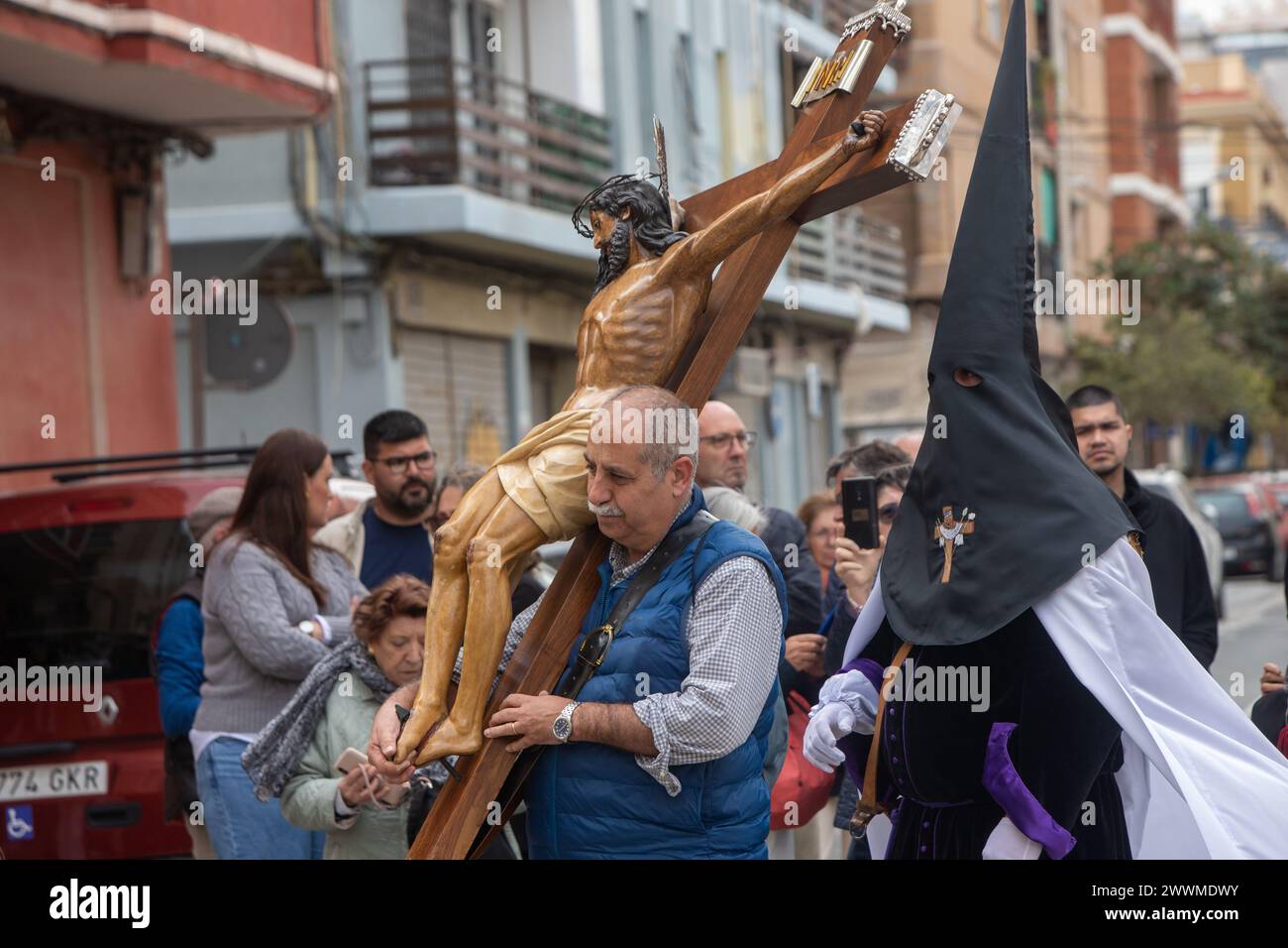Penitents during a Holy week parade at Cabanyal quarter in Valencia ...