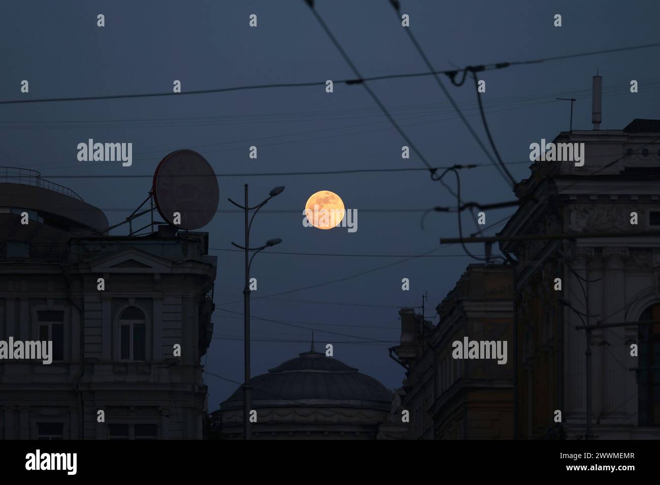 KHARKIV, UKRAINE - MARCH 24, 2024 - The moon shines in the sky as the ...