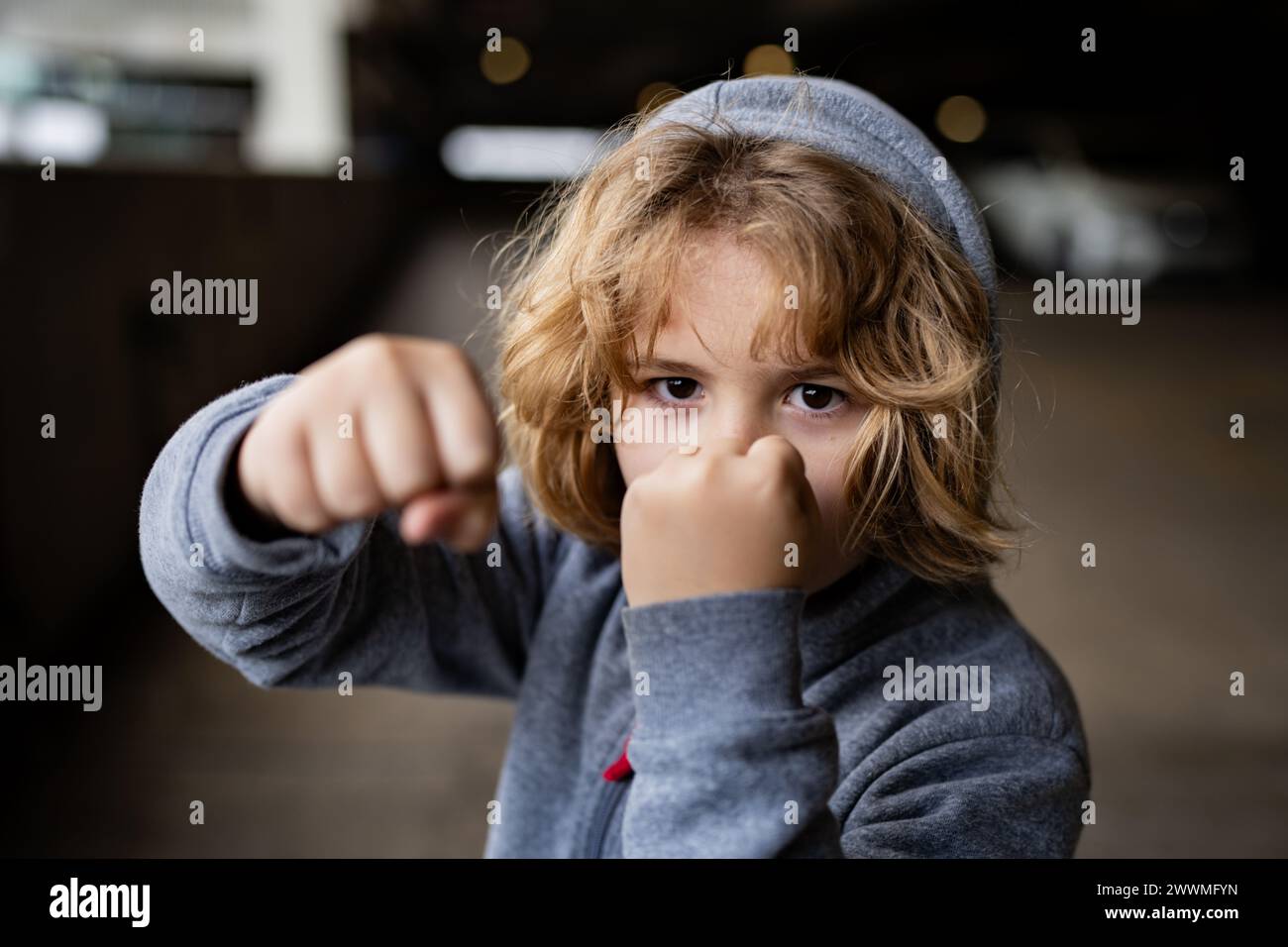Aggressive anger child. Little kid boy anger on street. Angry little ...