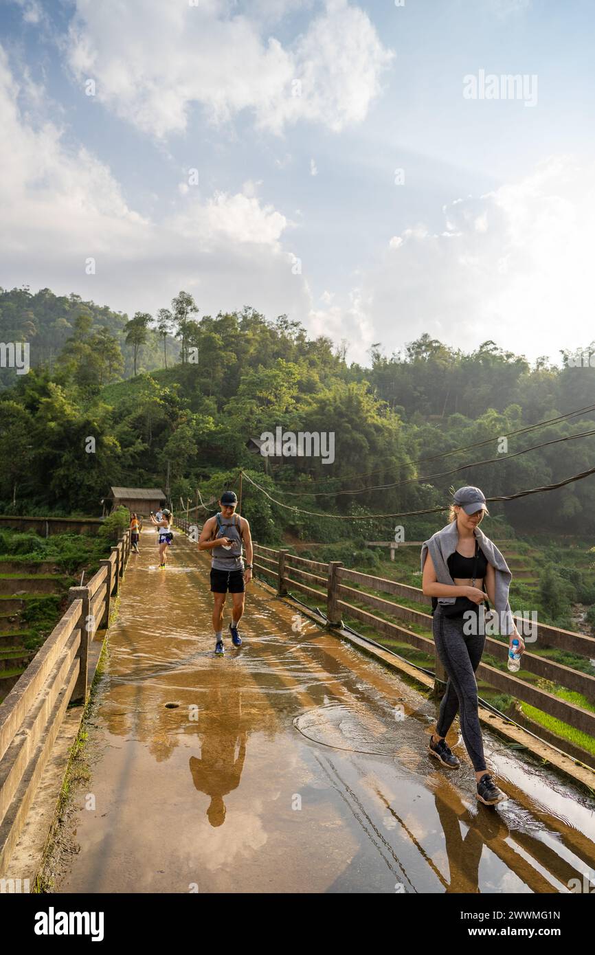Adventurous Friends Trekking Through Sa Pa Rice Fields at Sunrise Stock ...