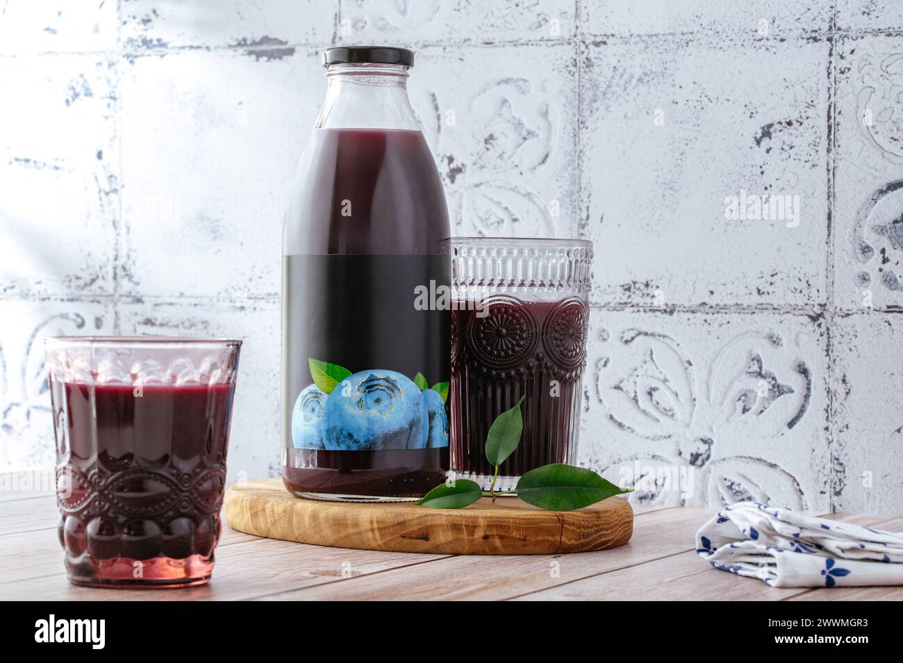 blueberry juice nectar in a glass bottle on the table Stock Photo - Alamy