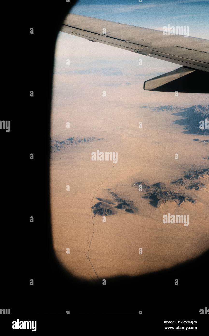 Airplane Soaring The Over Desert Stock Photo - Alamy
