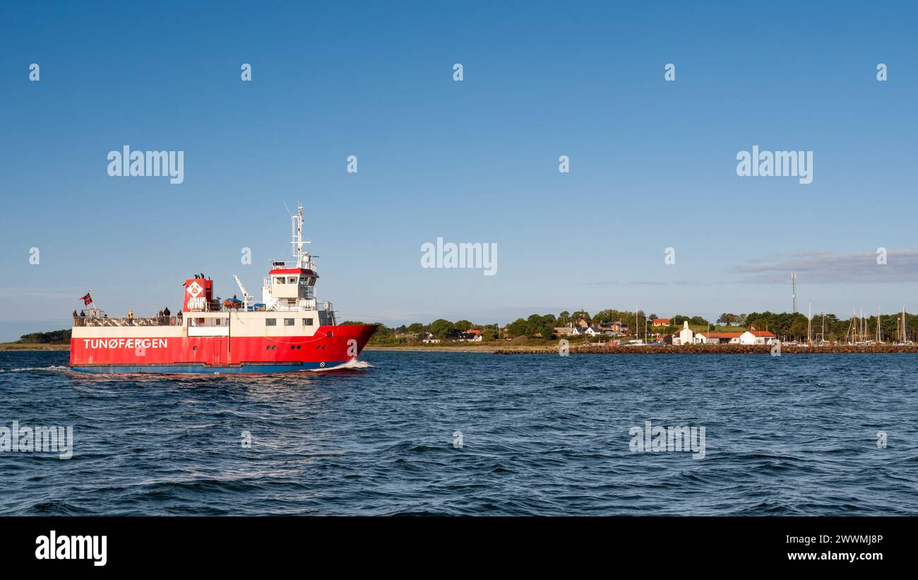 Ferry boat Tunøfaergen with passengers approaching harbour of Tunø ...