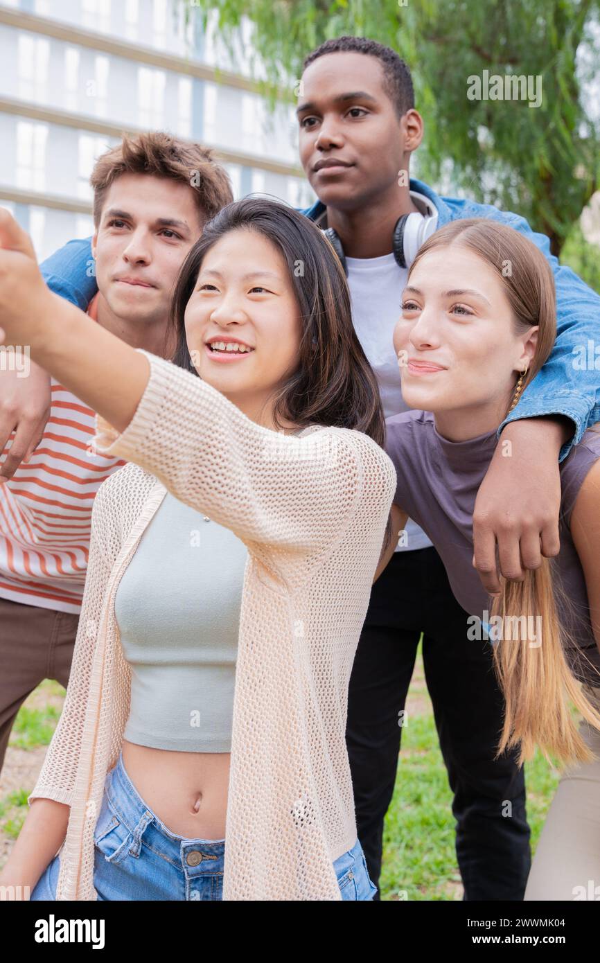 Vertical portrait Multiracial group of student friends laughing while ...