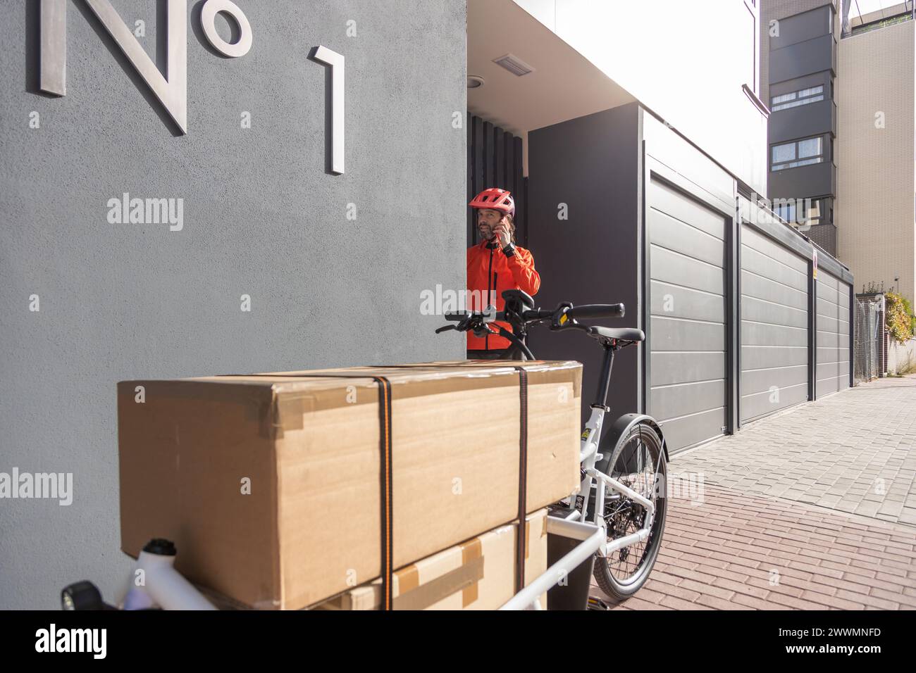 Man riding on an e cargo bike hi-res stock photography and images - Alamy