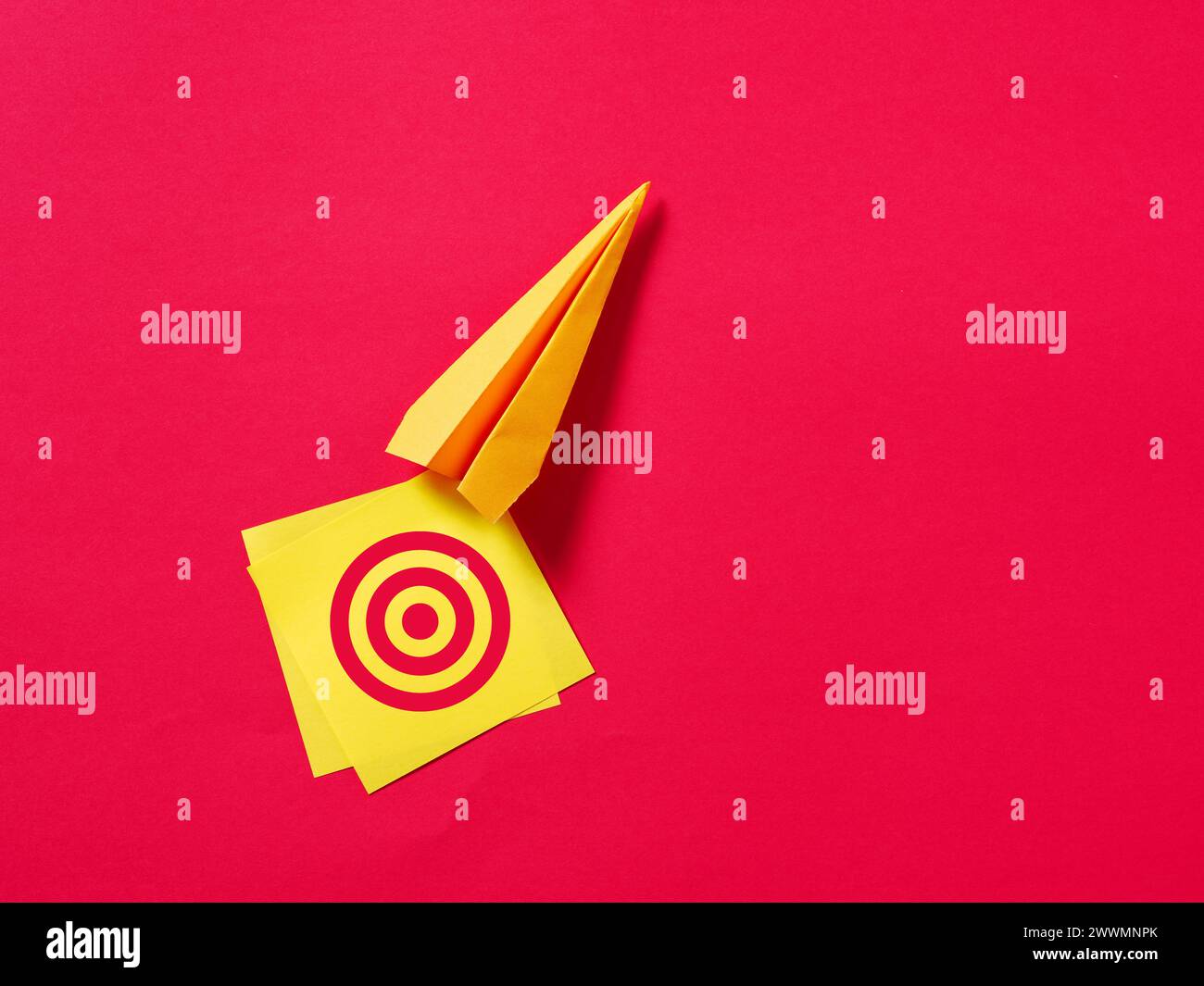 Goal setting, development and achievement. Paper plane carries a target ...