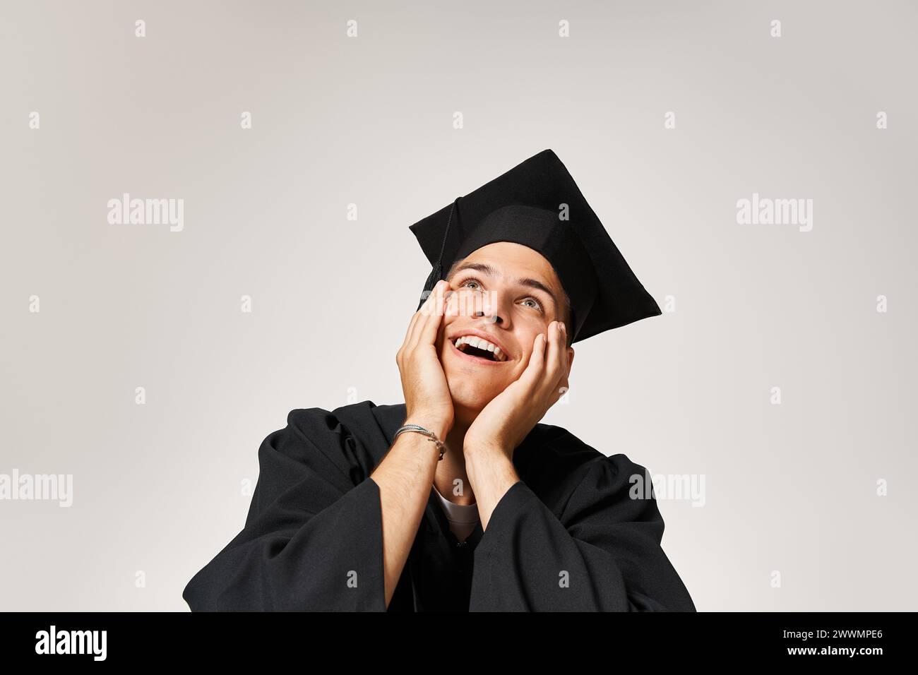 Happy graduate student diploma sitting hi-res stock photography and ...