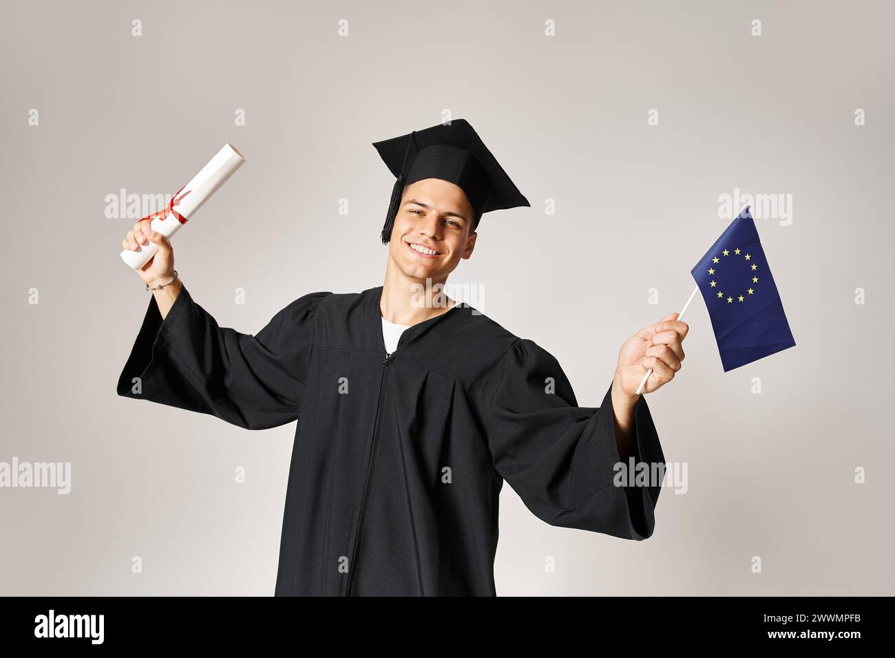 european student in graduate outfit happy to have completed his studies ...