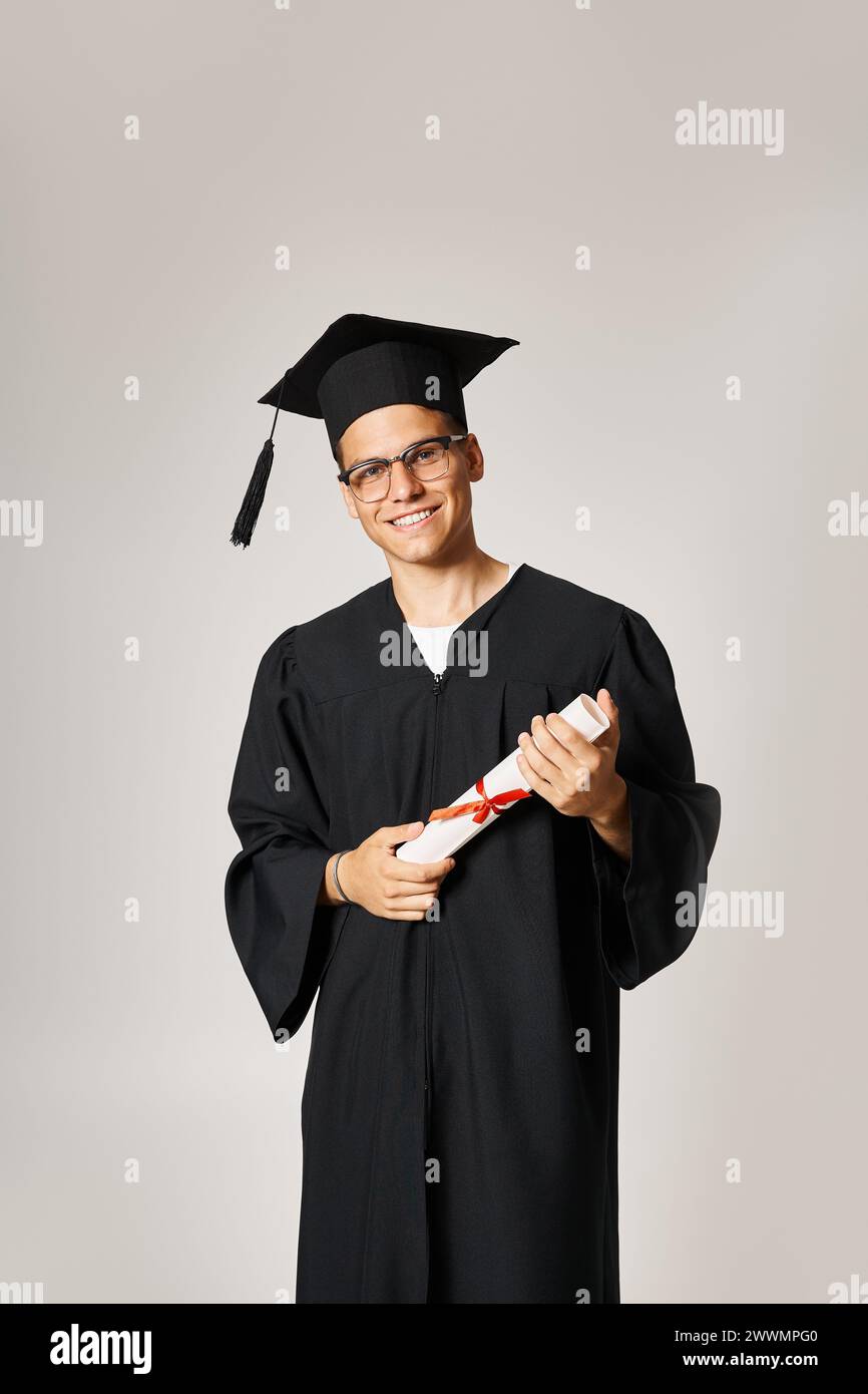 confident student in graduate outfit with vision glasses smiling with ...