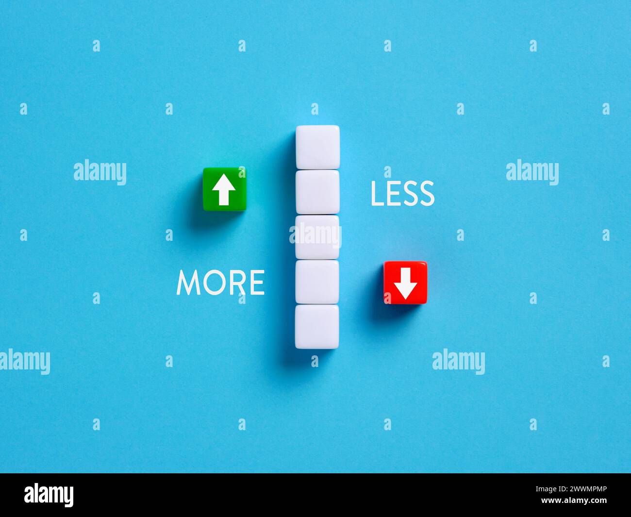 Opposite arrows with Less versus More Stock Photo - Alamy