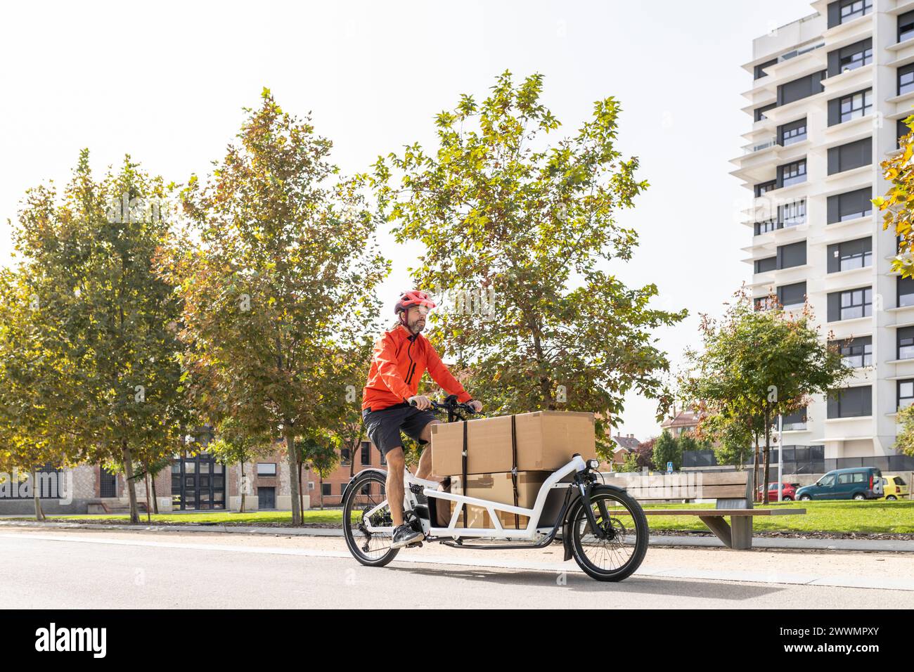 Man riding on an e cargo bike hi-res stock photography and images - Alamy