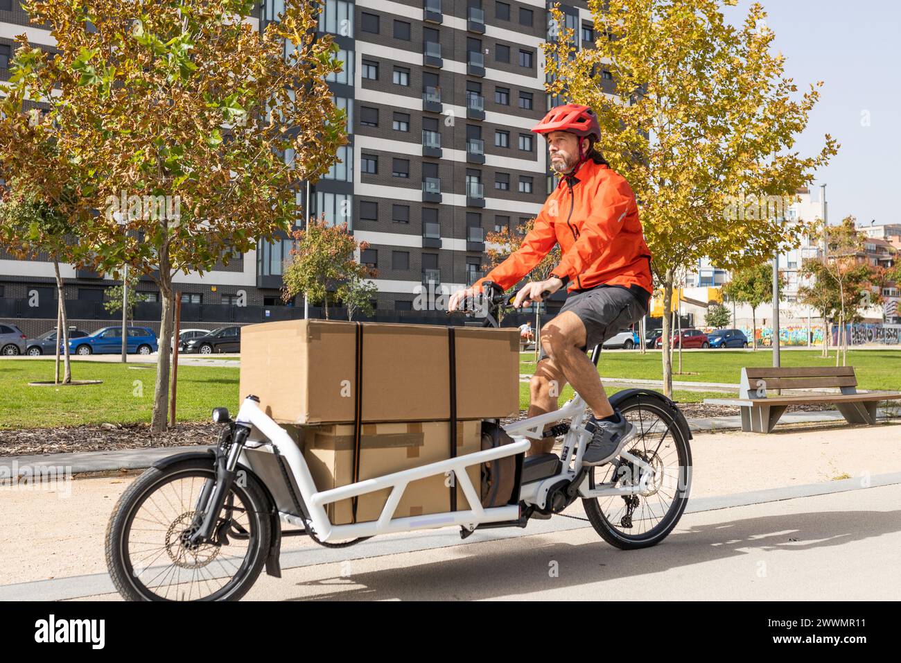 Man riding on an e cargo bike hi-res stock photography and images - Alamy