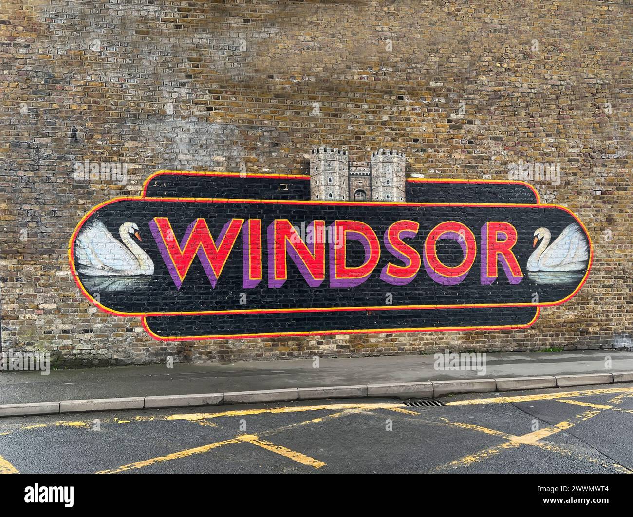 A painted sign indication direction to Windsor Castle in Windsor United ...