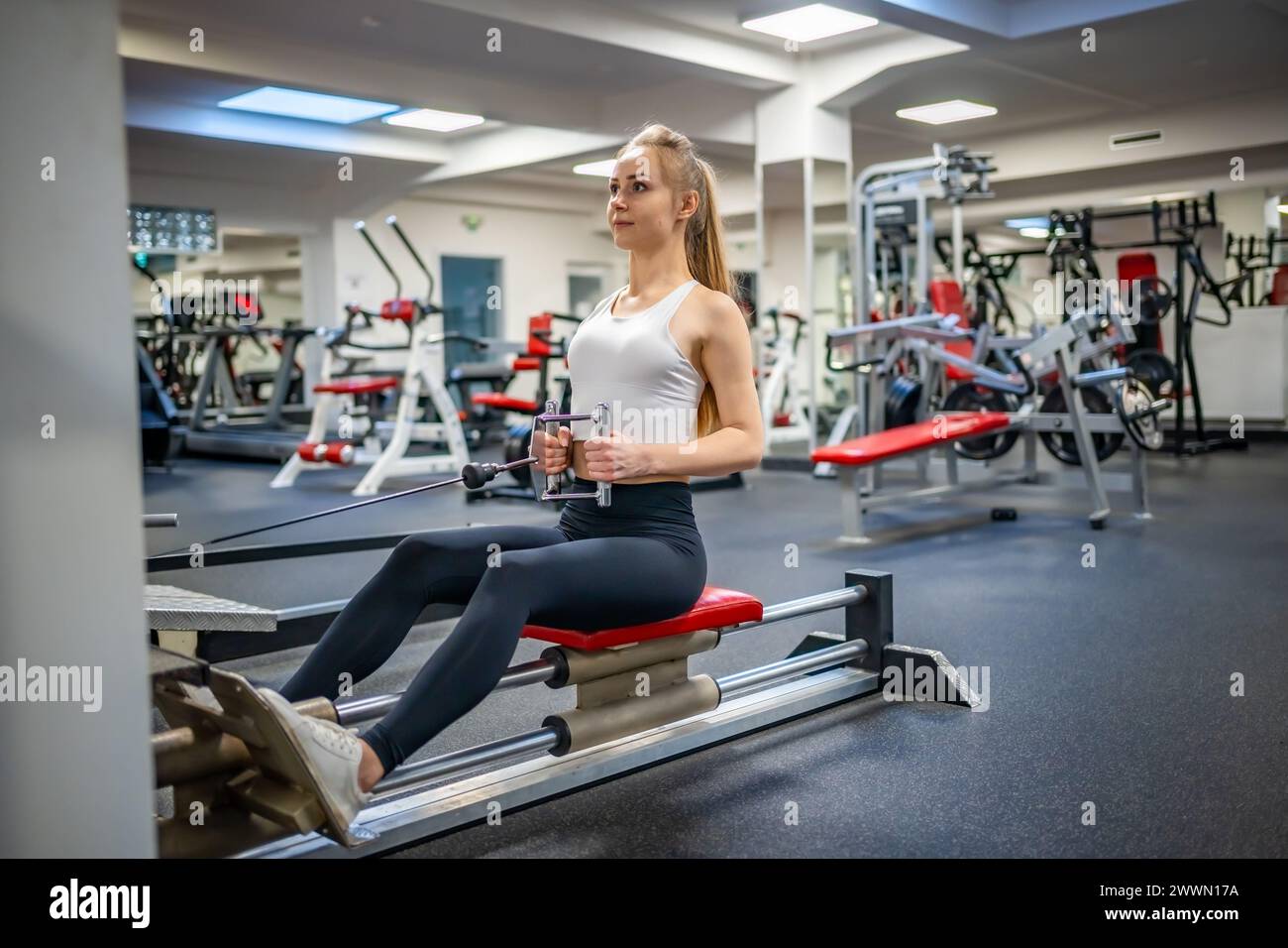 Young sport woman wearing sport wear doing exercise with fitness ...