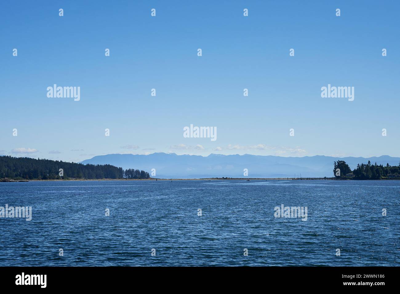 View looking over the beautiful ocean water towards a distant spit and ...