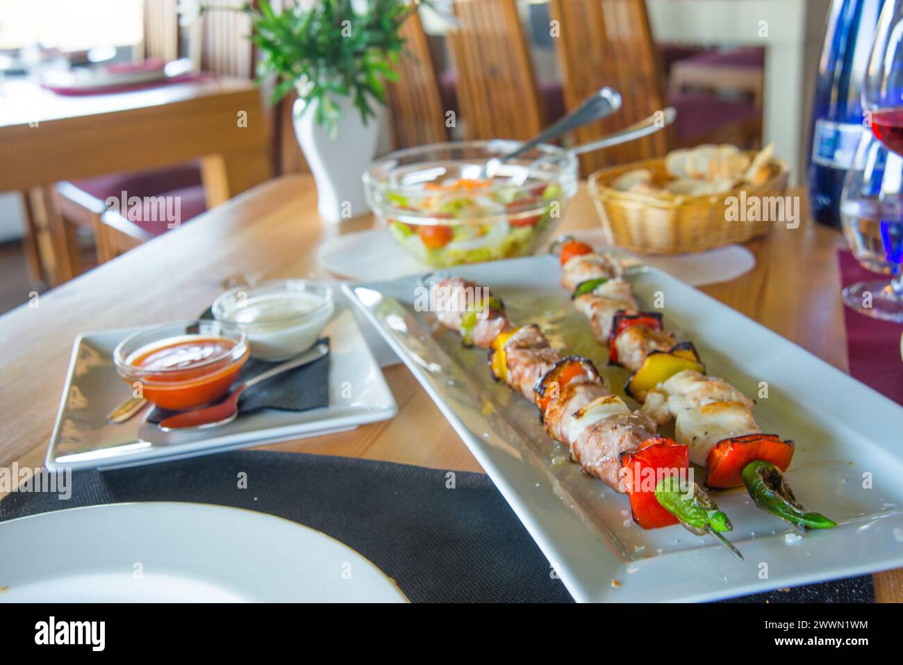 Brochette of meat and vegetables in a restaurant Stock Photo - Alamy