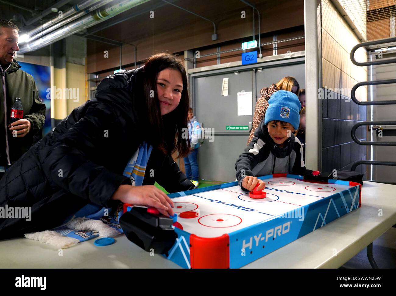Coventry City fans play table top air hockey at the Coventry Building ...