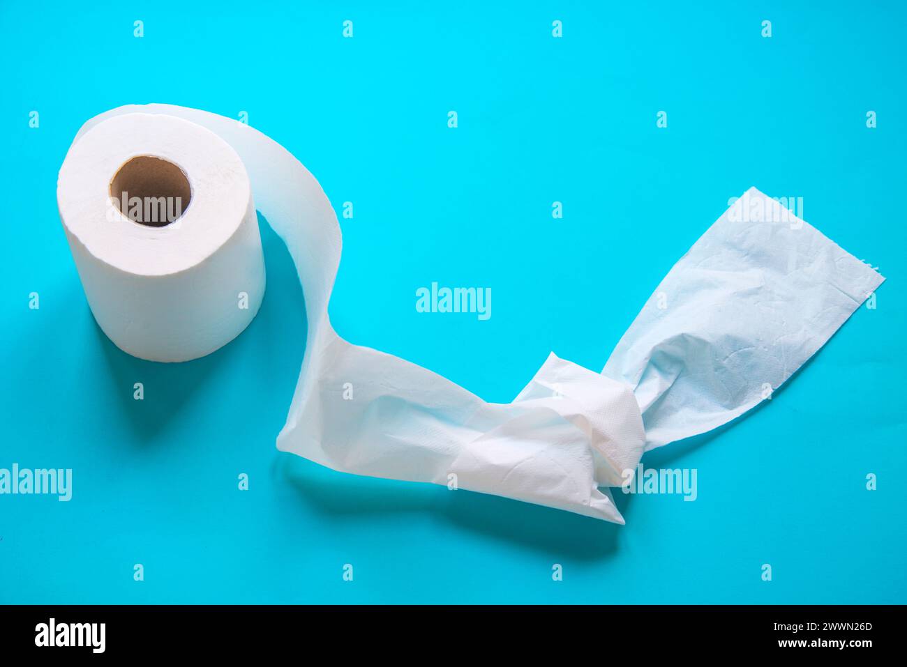 Roll of toilet paper with a knot Stock Photo - Alamy