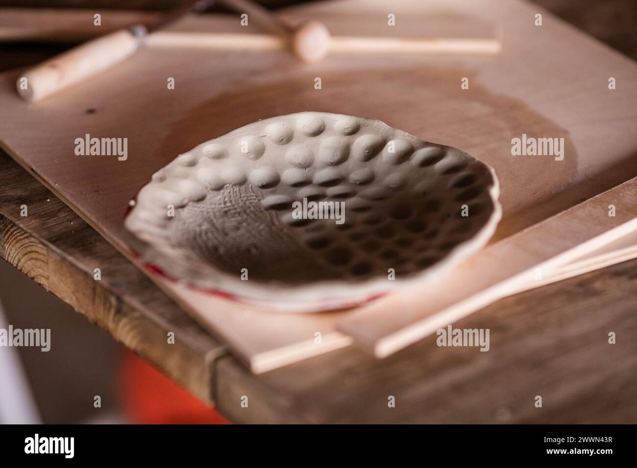 Handmade Ceramics: Artisan Crafting Raw Clay Plate by Hand Stock Photo ...