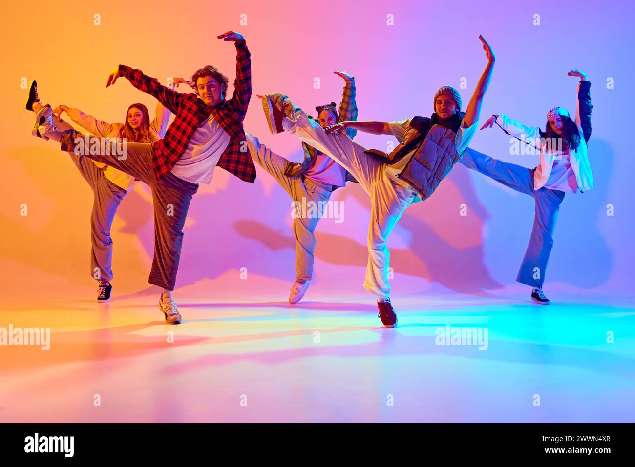 Young people, men and women in dynamic poses dancing hip hop ...