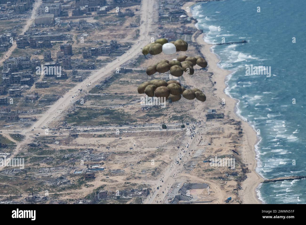 25 March 2024, Palestinian Territories, Gaza: Parachutes with food ...