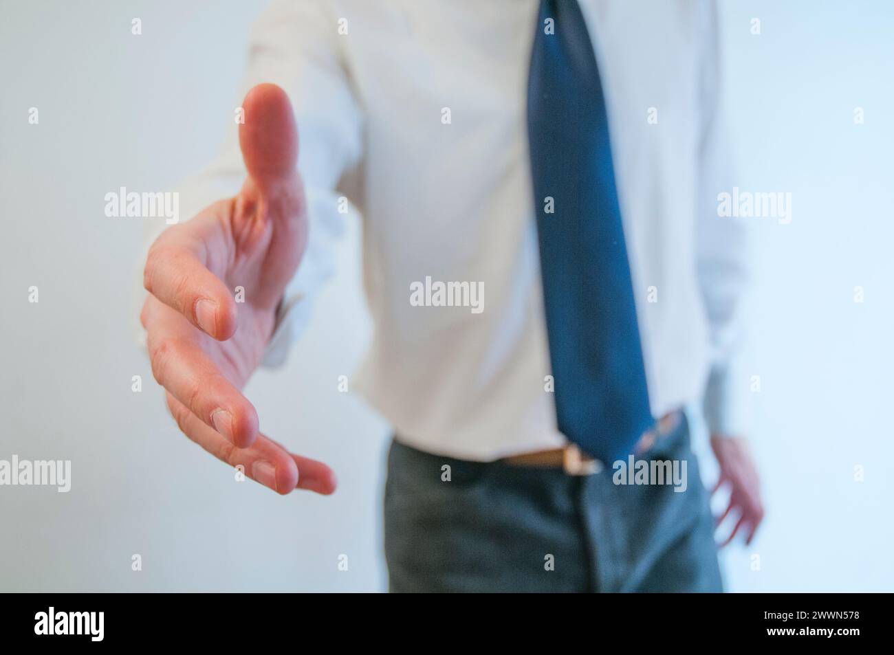 Man extending his open hand, offering handshake Stock Photo - Alamy
