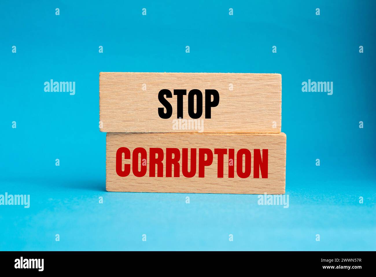Stop corruption words written on wooden blocks with blue background ...