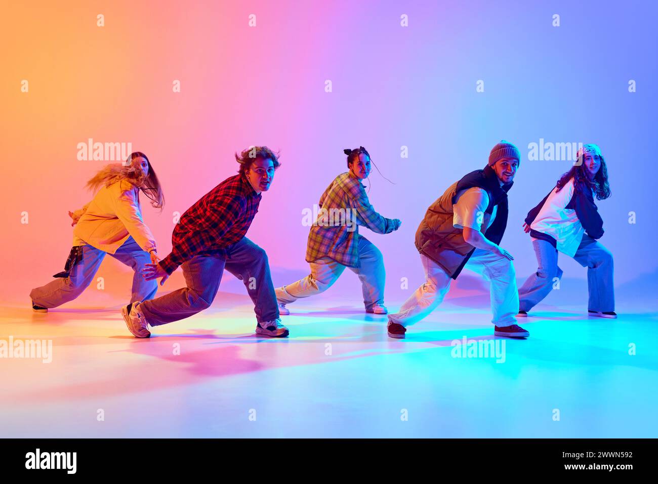 Young people, men and women in dynamic poses dancing hip hop ...