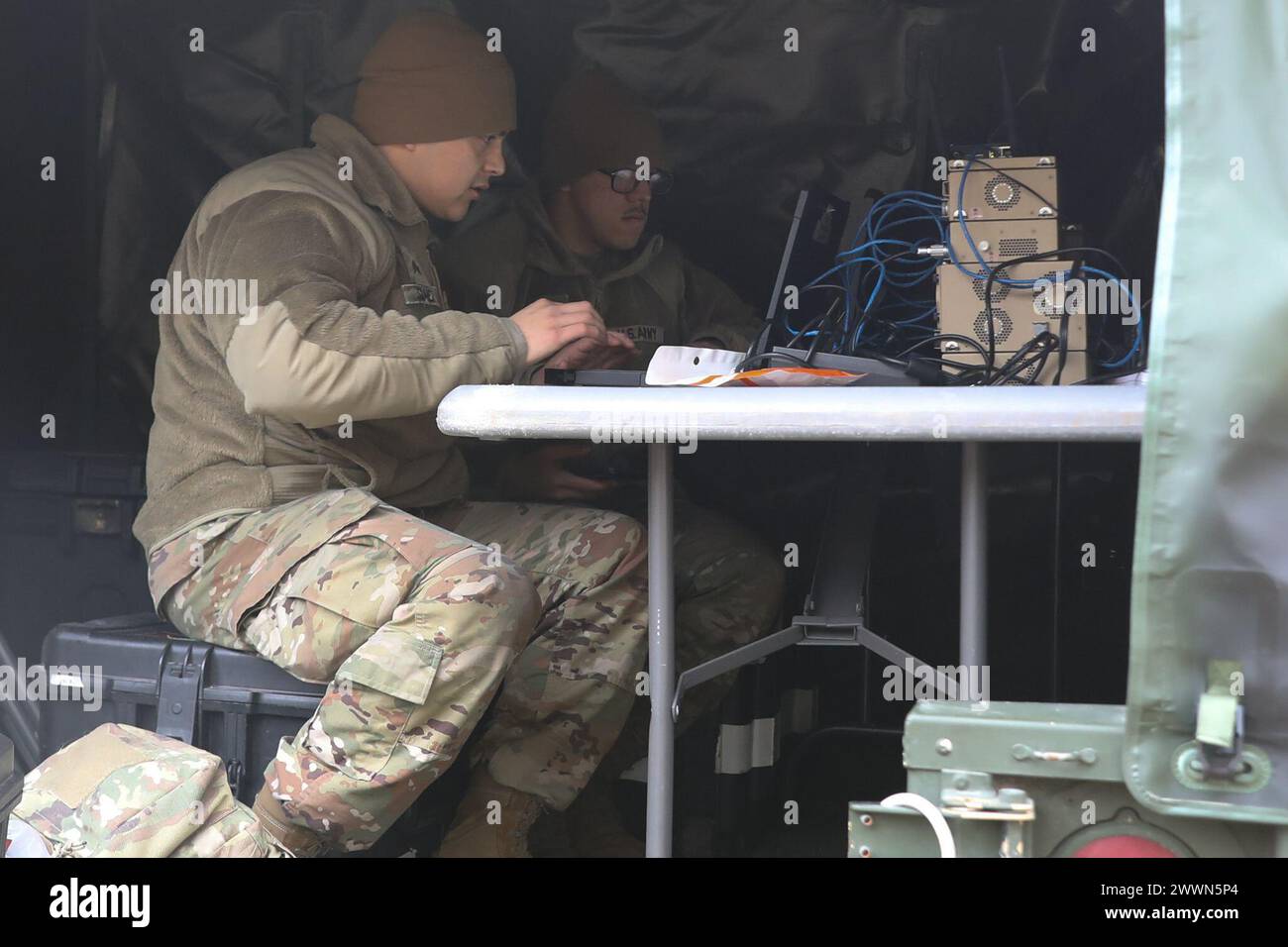 U.S. Army Soldiers Sgt. Geovanni Suarez (left) and Spc. Miguel Franco (right) assigned to Bravo ...