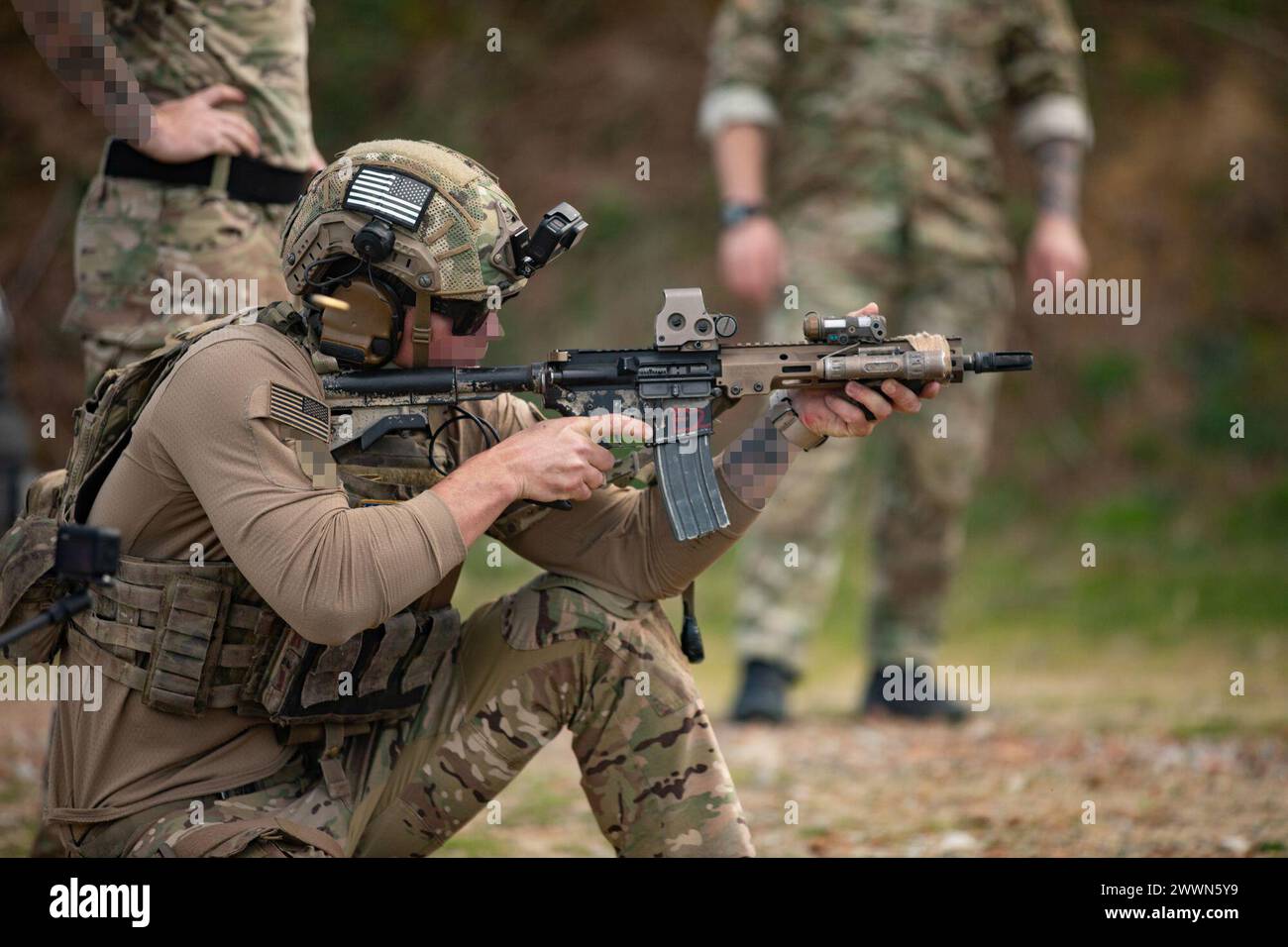 A Green Beret assigned to 10th Special Forces Group (Airborne) fires a ...