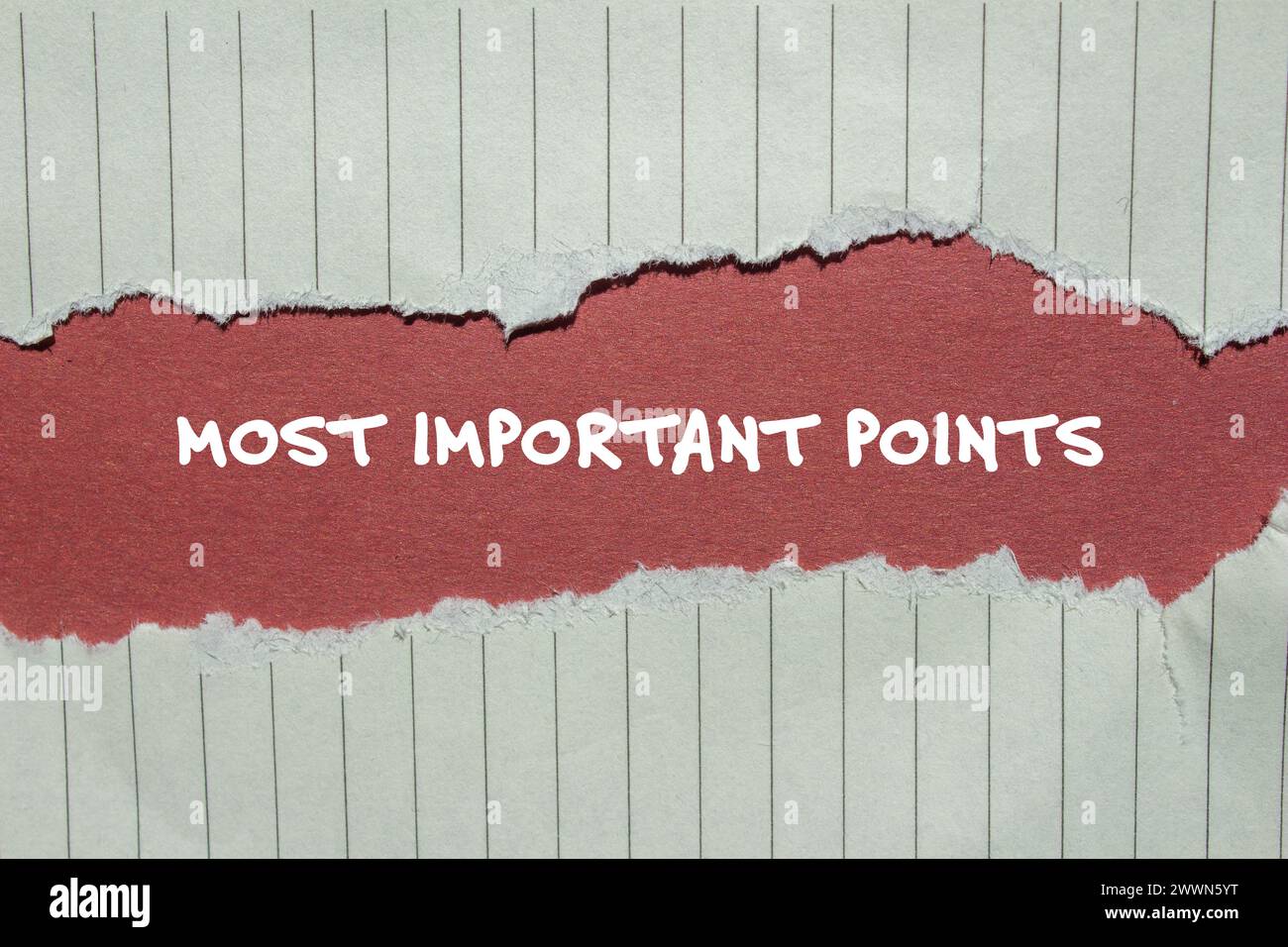 Most important points words written on torn paper with red background ...