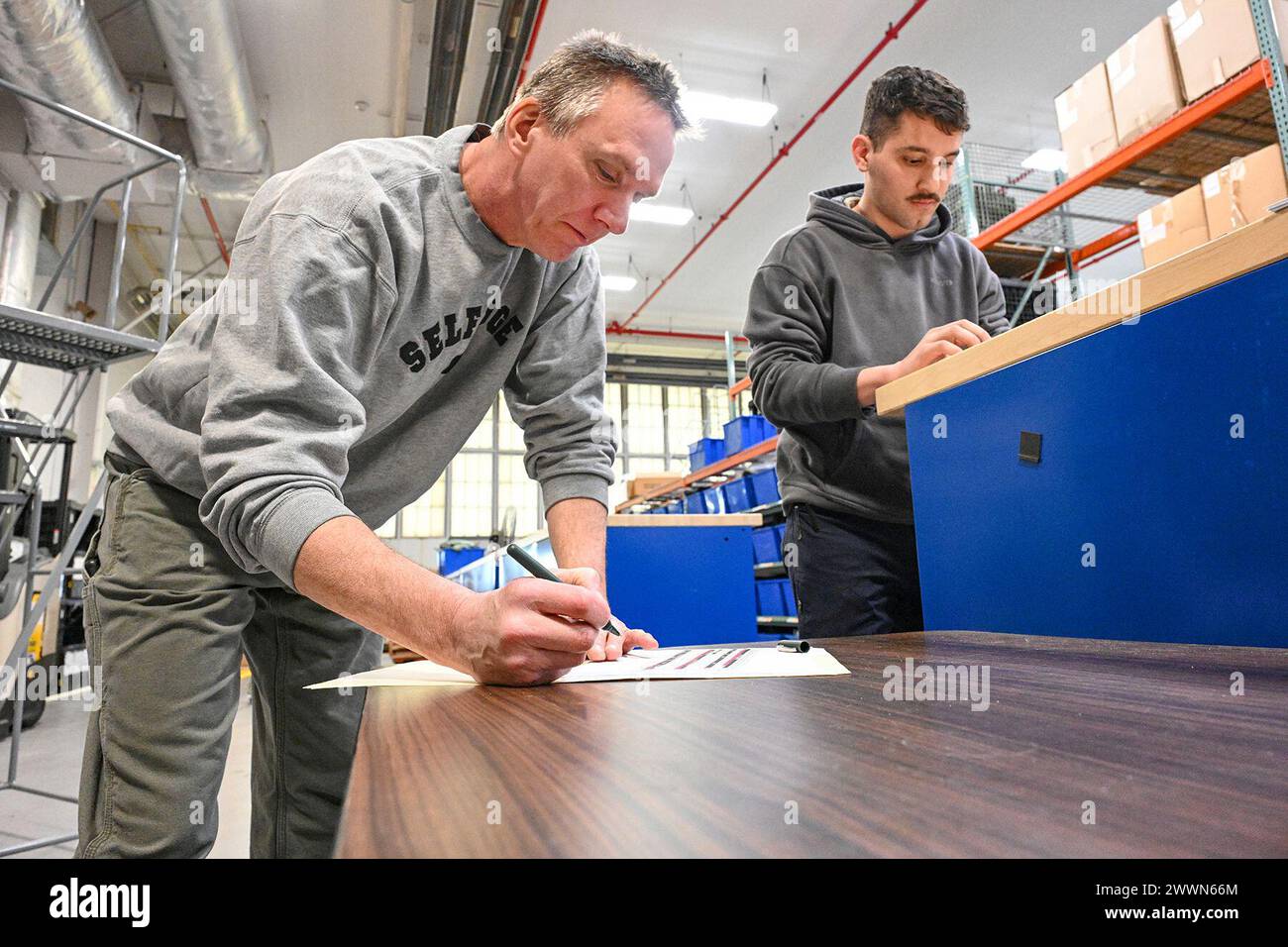 Joseph Korotko, left, an individual protective equipment technician ...