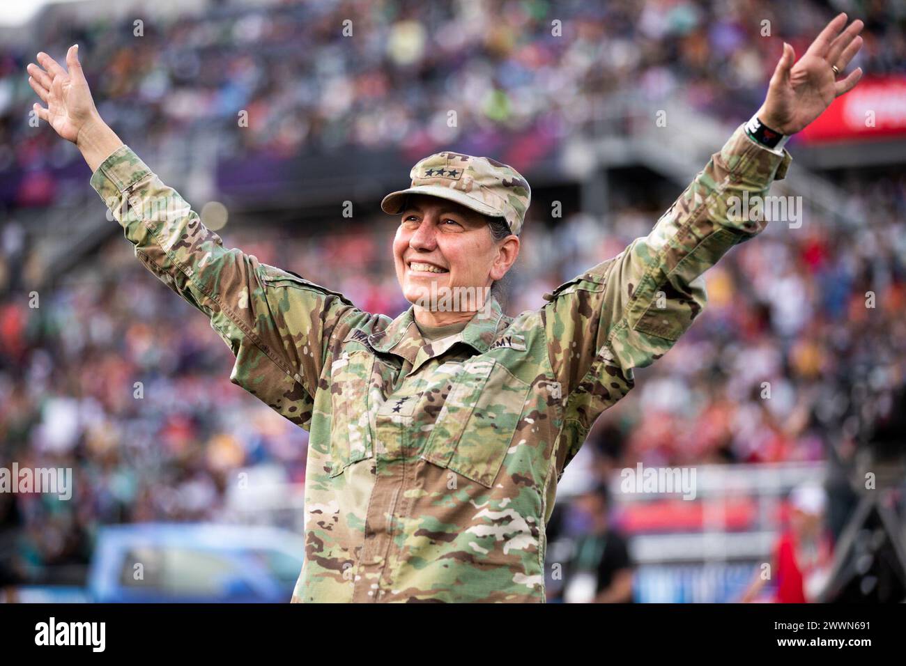 Chief of the Army Reserve Lt. Gen. Jody Daniels waves to the crowd ...