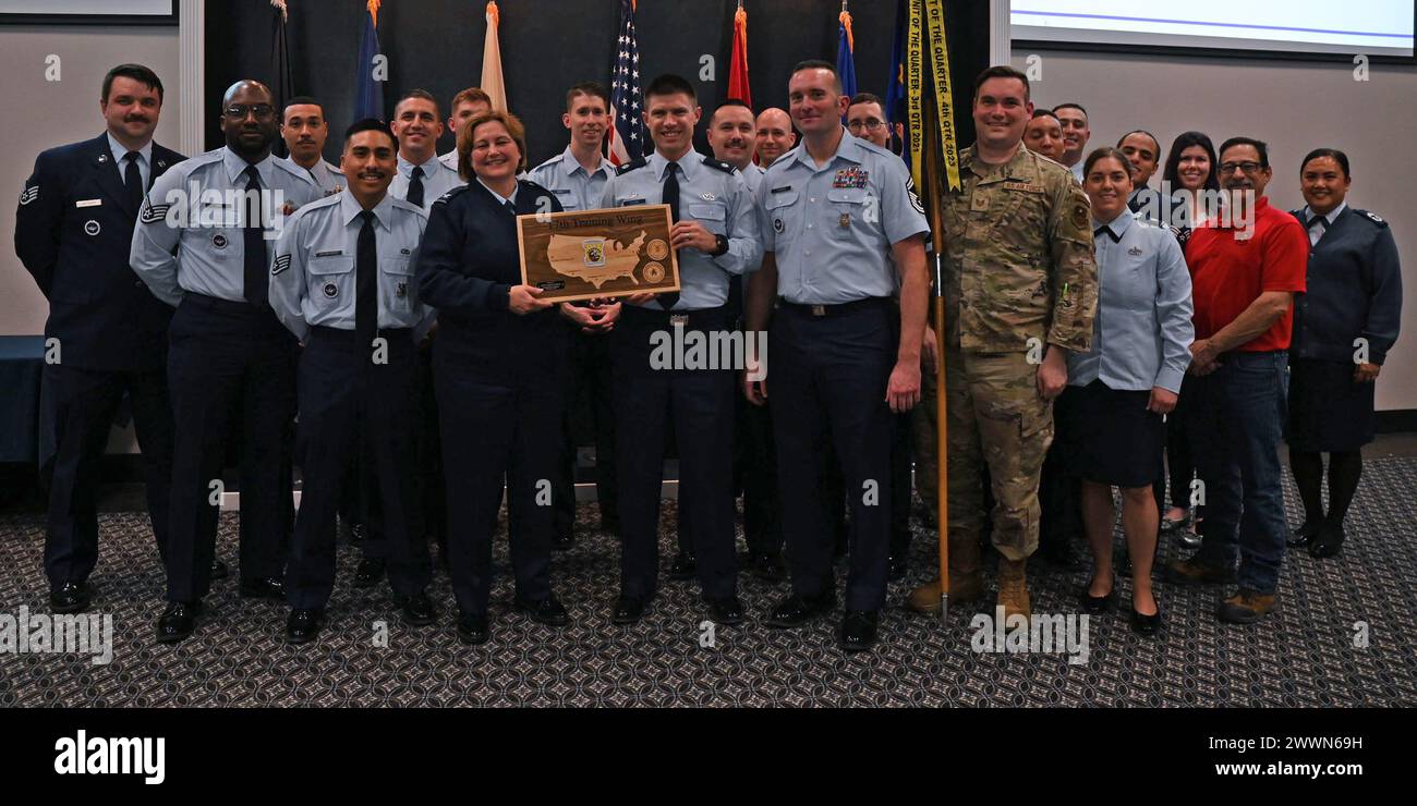 Airmen assigned to the 312th Training Squadron pose for a group photo ...