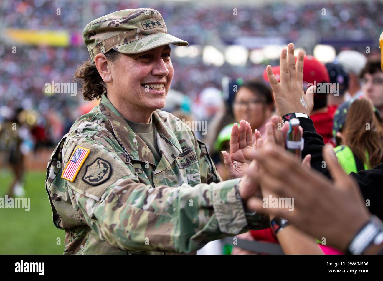Chief of the Army Reserve Lt. Gen. Jody Daniels greets fans along the ...