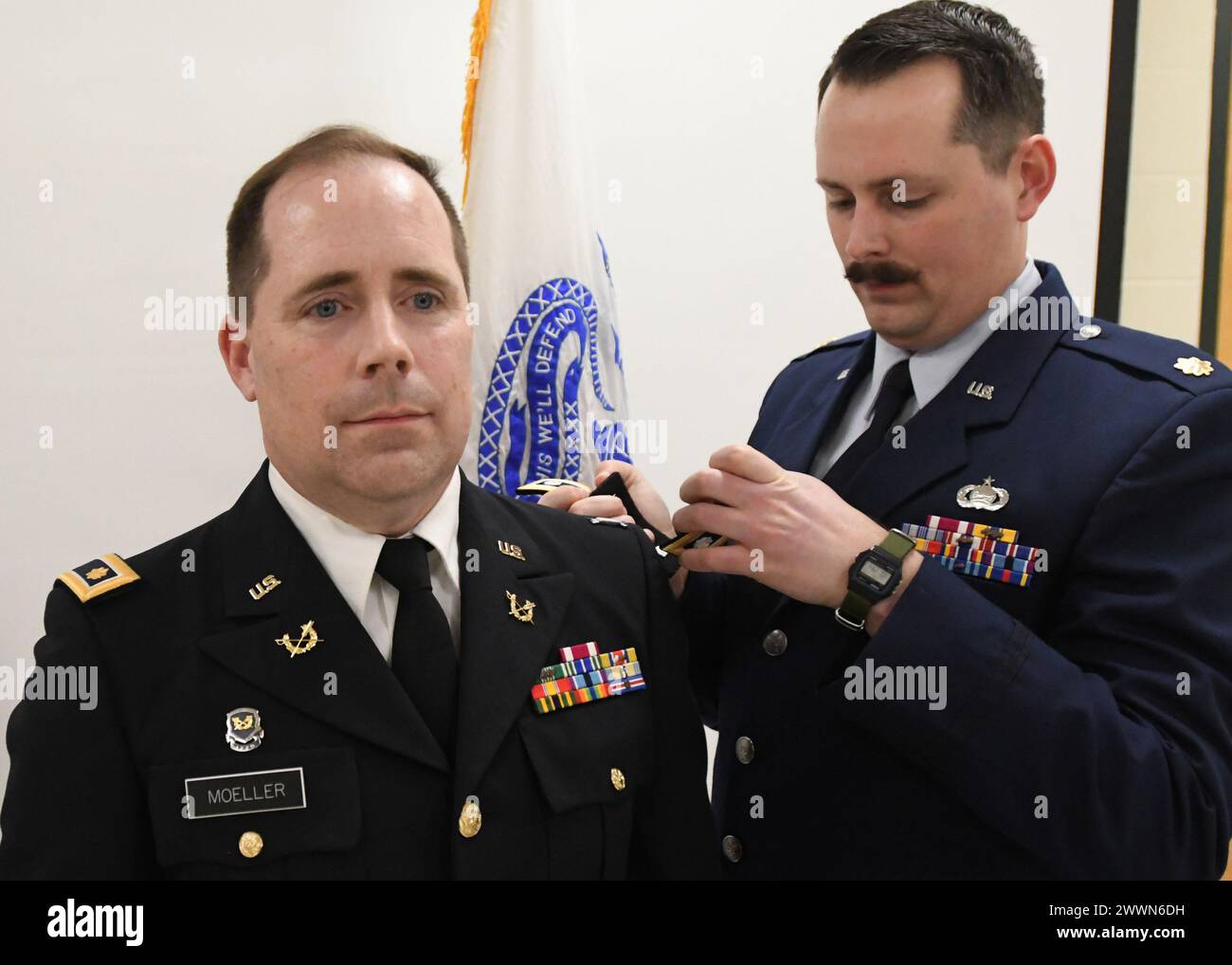 Air Force Maj. James Moeller replaces his brother's major shoulder ...