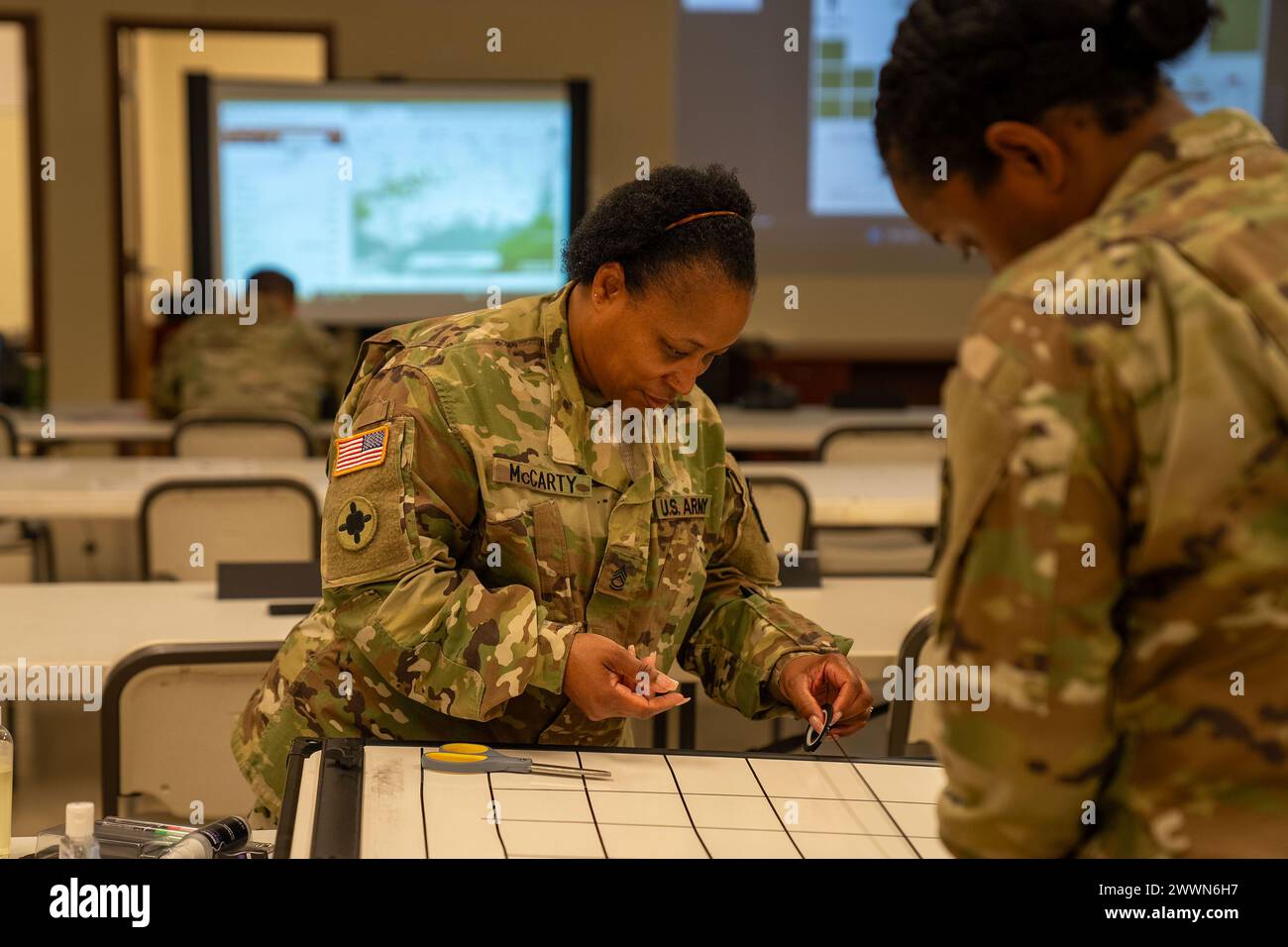 Sgt. 1st Class Vanessa McCarty, senior paralegal, and Staff Sgt ...