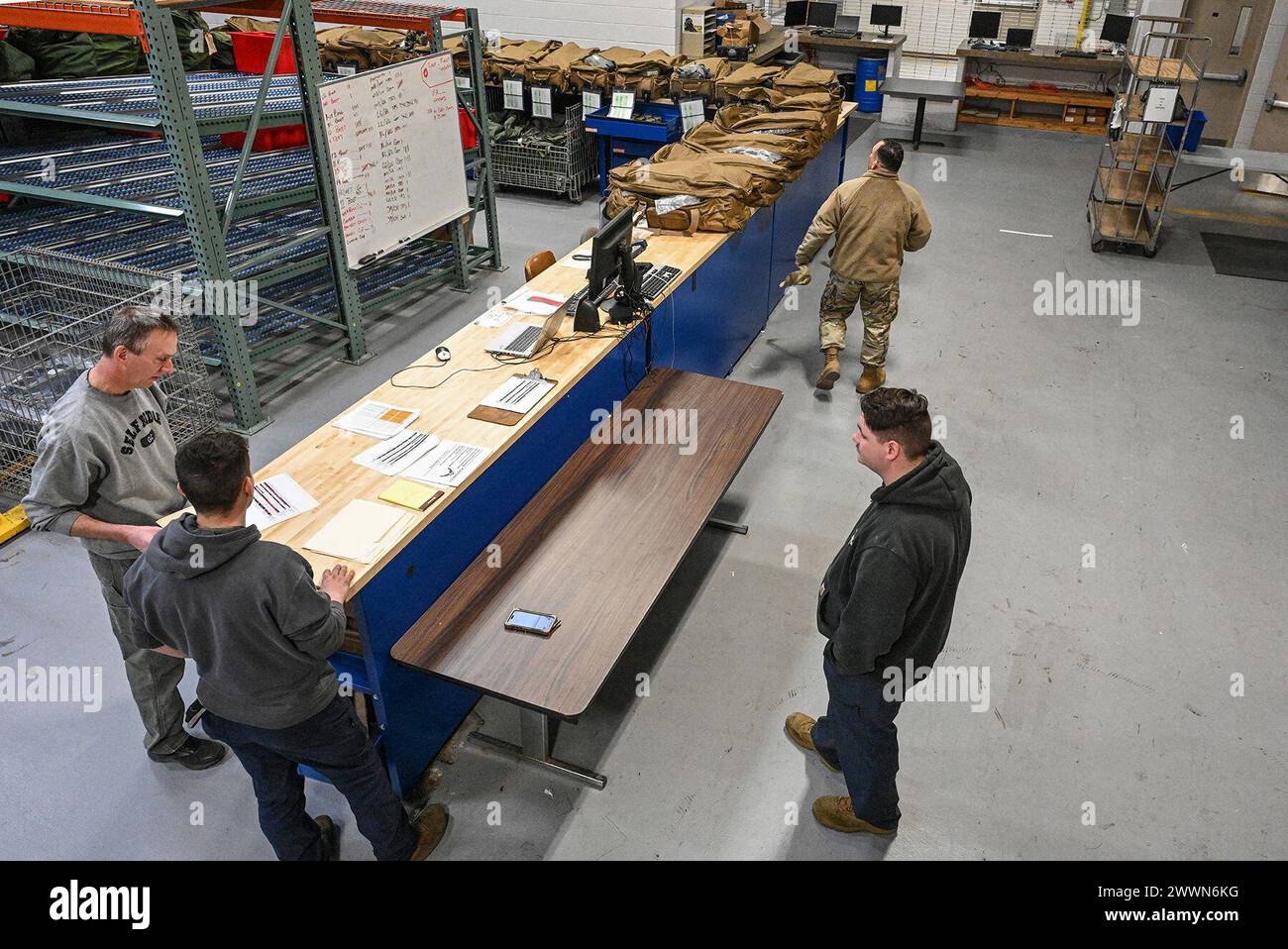 Joseph Korotko, left, an individual protective equipment technician ...