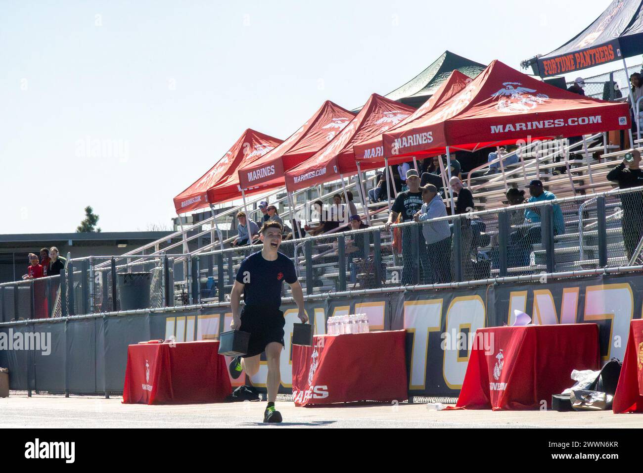A U.S. Marine Corps Recruiting Station Sacramento poolee runs with ...