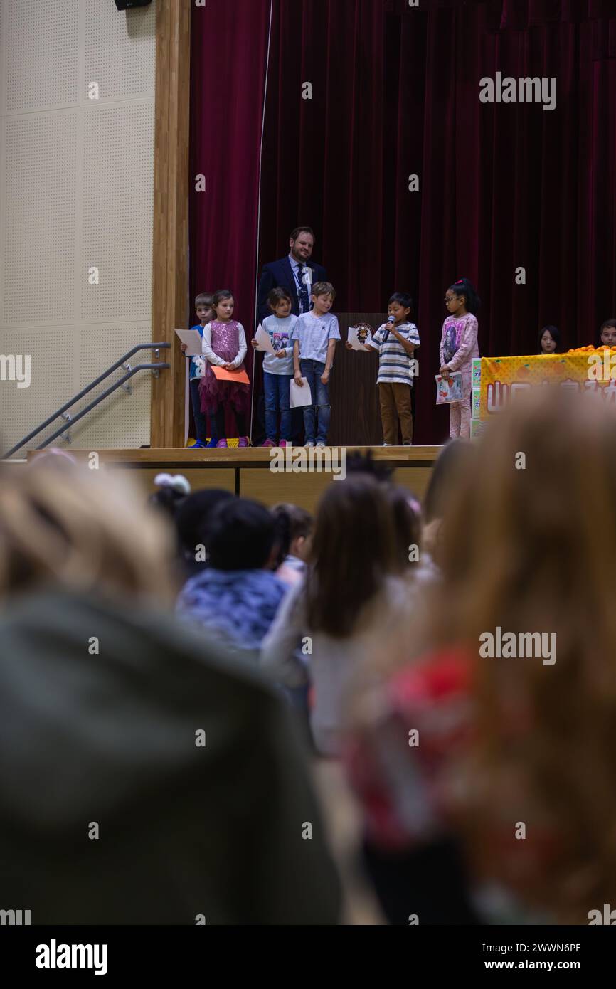 Students from Matthew C. Perry Primary School present poems during the ...