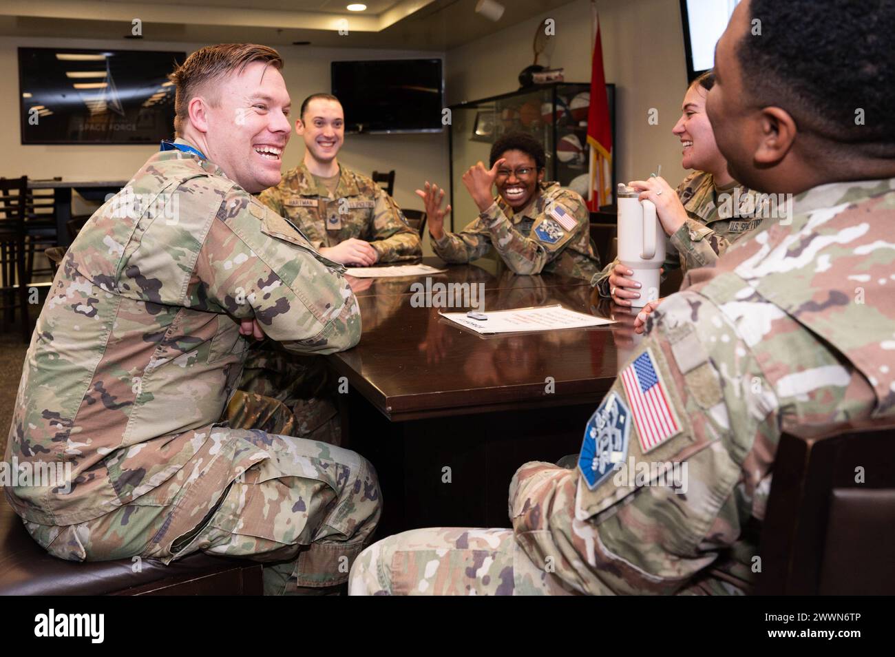 Five service members laugh and converse on Cheyenne Mountain Space ...