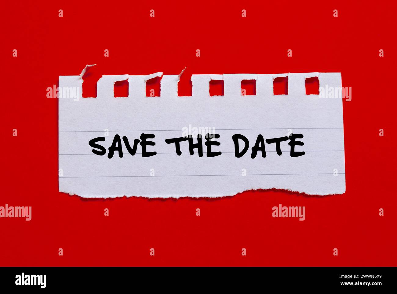 Save the date words written on torn paper piece with red background ...