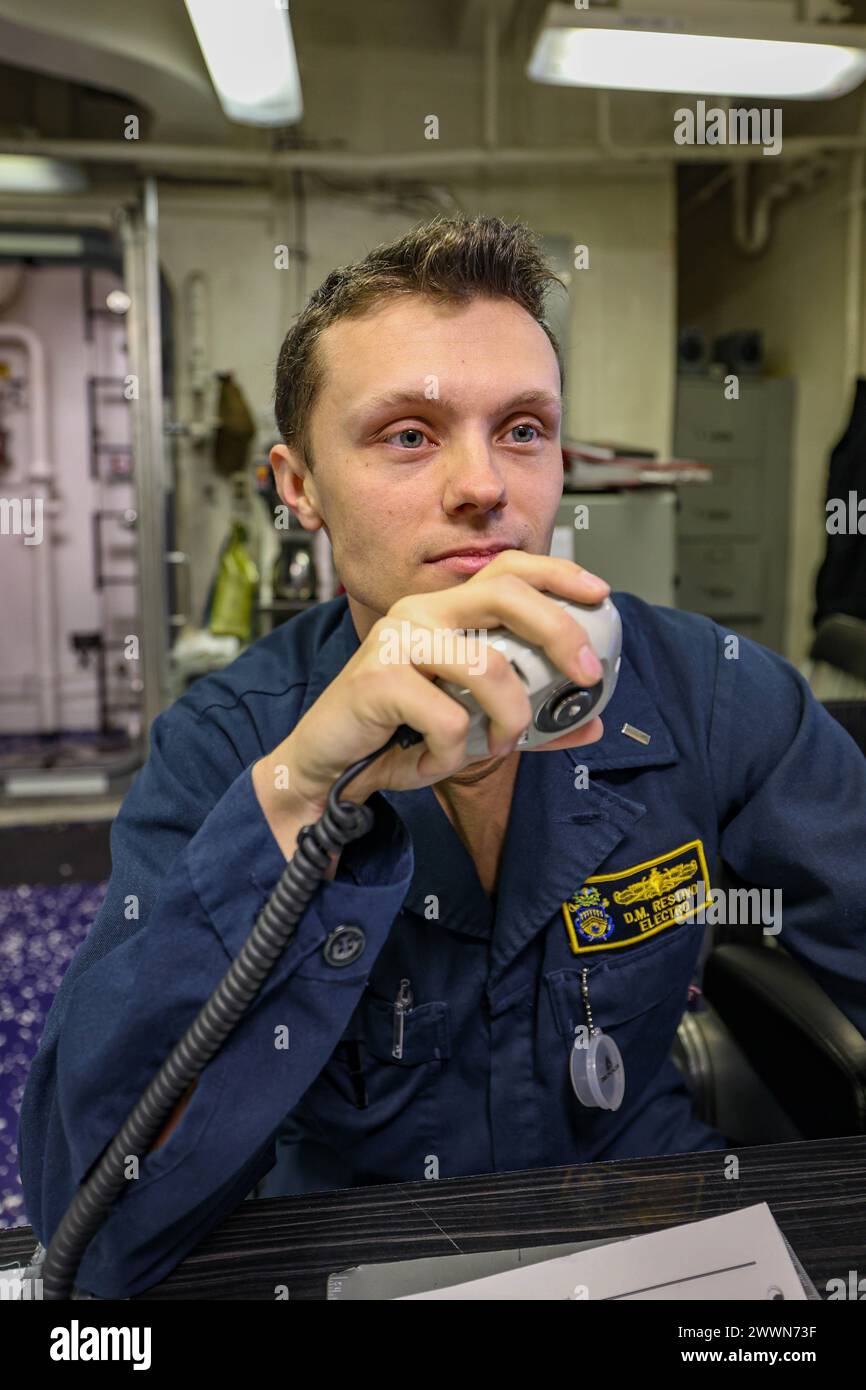SOUTH CHINA SEA (Feb. 21, 2024) Lt. j.g. Dom Restivo stands watch in ...